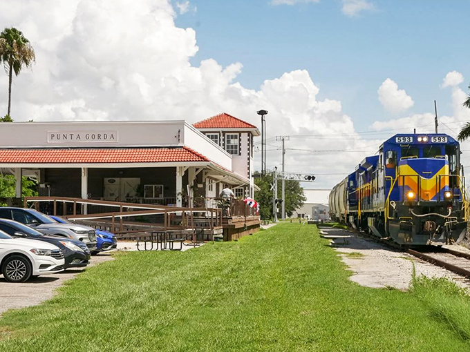 Punta Gorda's charming station stands ready as the colorful locomotive approaches, like an old friend arriving for a long-overdue visit.