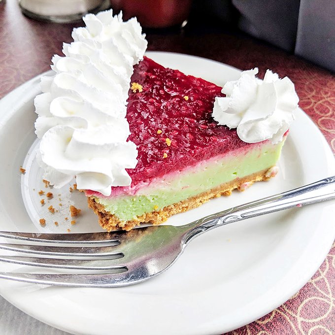 This raspberry key lime pie doesn't need a filter &ndash; it's already wearing its Sunday best with that whipped cream tiara.