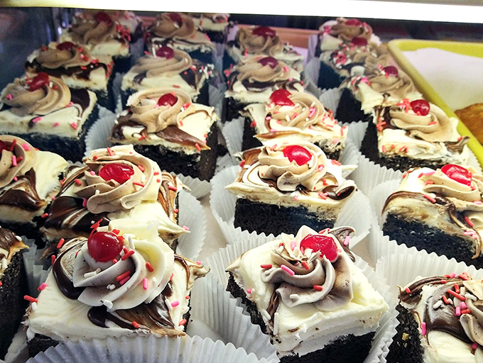 These red velvet brownies with their swirled topping and cherry garnish aren't just desserts &ndash; they're edible formal wear for your taste buds.