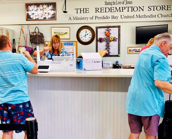 "Sharing the Love of Jesus" adorns the checkout area, where friendly volunteers ring up treasures that fund community outreach programs.