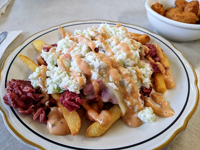 These aren't just fries; they're a Reuben sandwich that decided to party with potatoes instead of rye bread.