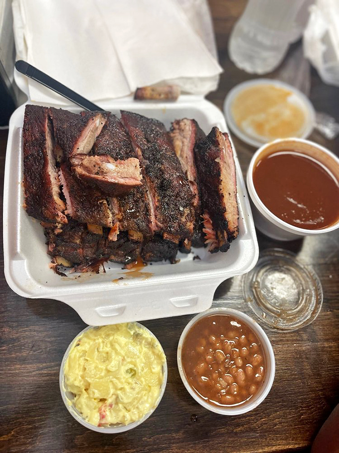 Ribs with that perfect smoke ring and sides that don't play second fiddle. This isn't a meal; it's a masterclass in barbecue architecture.
