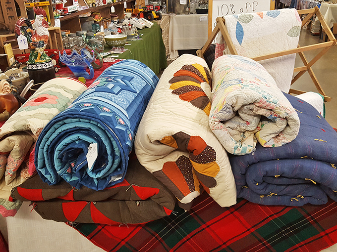 Handmade quilts rolled like colorful burritos of comfort. Each stitch tells a story of patience and craftsmanship rarely seen in today's mass-produced world.