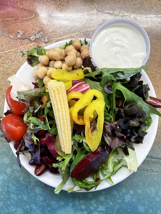 Even the salads at Gill's celebrate the bounty of California, with baby corn, fresh greens, and chickpeas creating a colorful canvas of healthy indulgence.