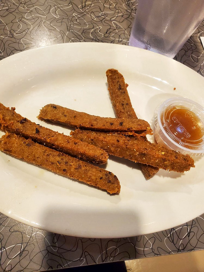 Scrapple transformed into crispy golden sticks &ndash; because sometimes tradition needs a modern makeover with honey.
