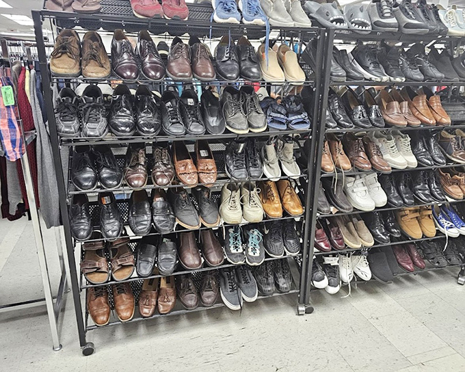 Men's shoes arranged with military precision—from barely-worn loafers to those sturdy work boots with stories to tell about their previous adventures.