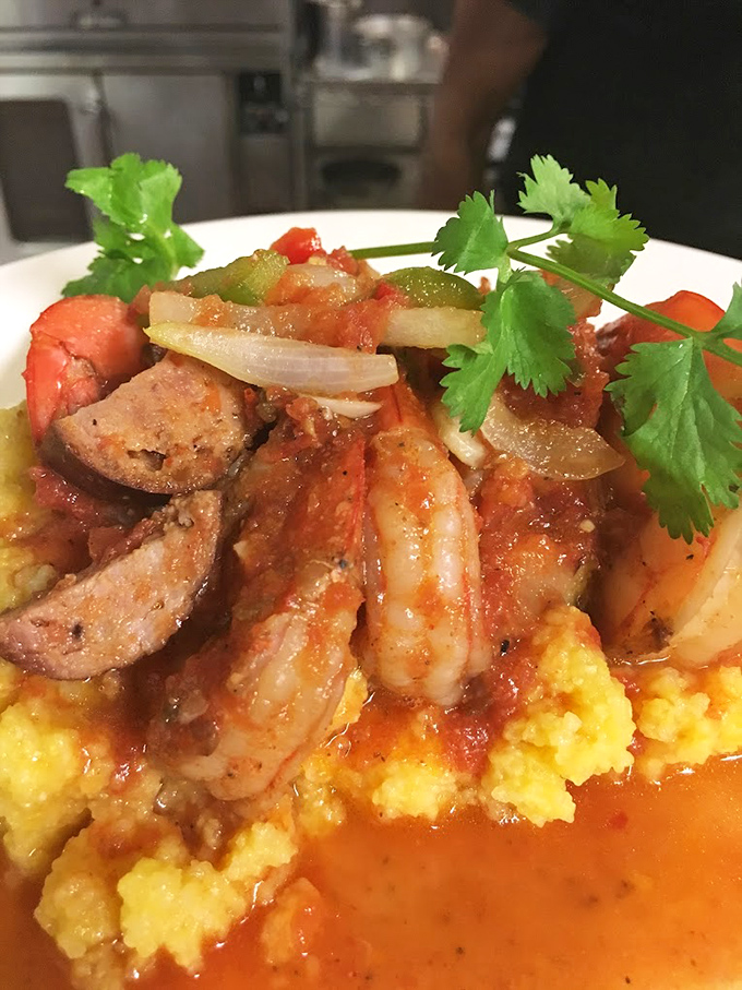 Shrimp and grits &ndash; a Southern classic that makes you wonder why anyone would eat oatmeal when this exists. Those yellow grits look like sunshine on a plate. 