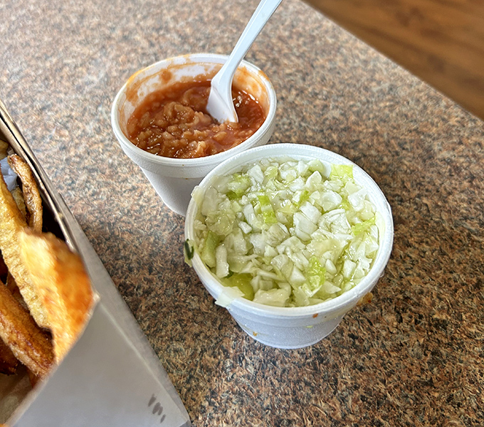 The supporting actors deserve their own spotlight: tangy tomato rice "hot sauce" and freshly chopped coleslaw. These sides aren't afterthoughts&mdash;they're essential characters.