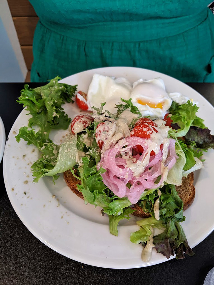 Avocado toast that would make millennials weep with joy, topped with pickled onions and a poached egg that's perfectly Instagram-ready.