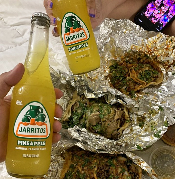 Jarritos pineapple soda: the sweet, fizzy counterpoint that cuts through richness and spice like a refreshing tropical breeze.
