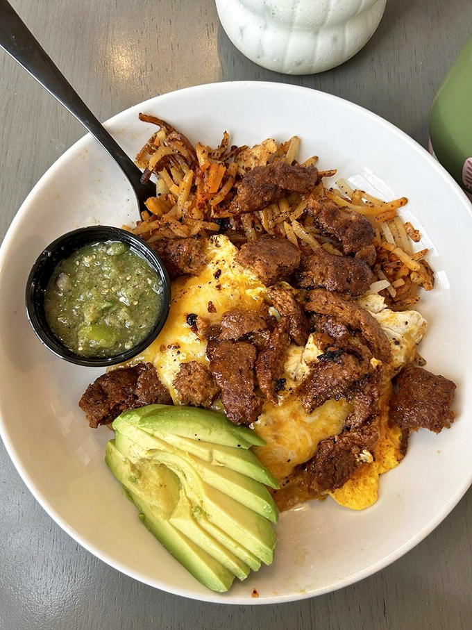 A breakfast bowl that means business&mdash;crispy potatoes, perfectly seasoned protein, and that avocado fan that says "someone cares about your Instagram."