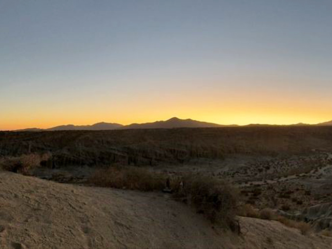 Golden hour magic transforms the canyon. As the sun sets, the landscape shifts from harsh desert to a painter's dream of warm hues.