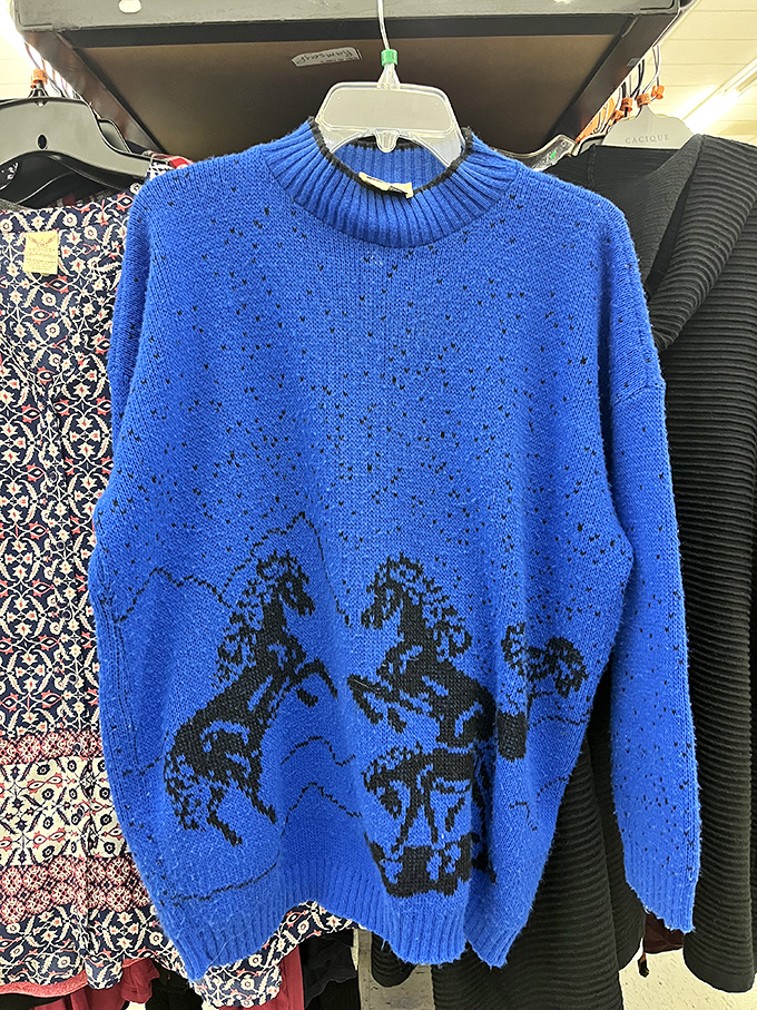 This vibrant blue horse-patterned sweater screams "conversation starter" at your next holiday gathering or ironic ugly sweater party.