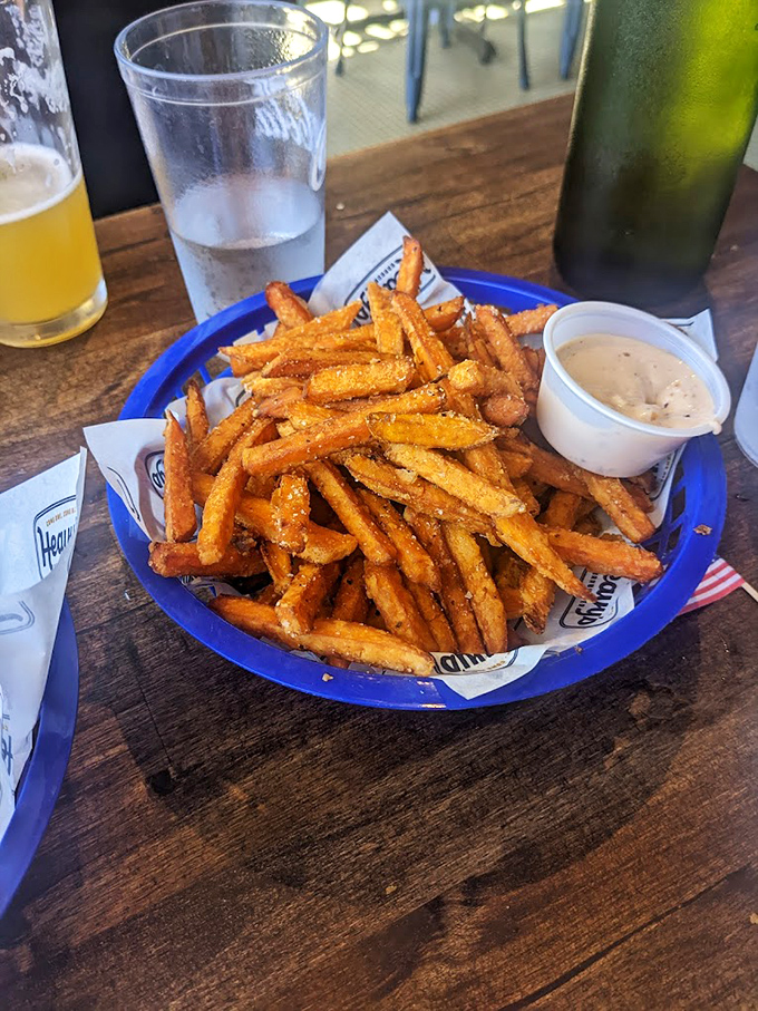 Sweet potato fries that achieve the impossible: crispy exterior, pillowy interior. The perfect sidekick to whatever sandwich masterpiece you've ordered.