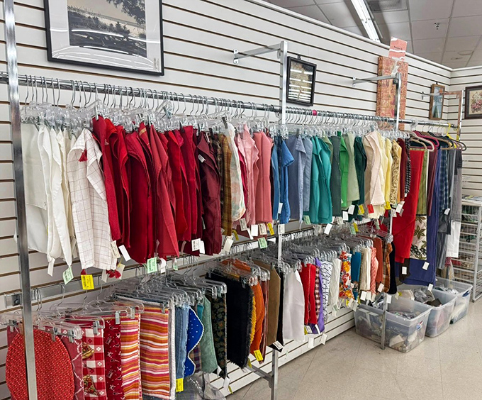 Color-coded clothing racks organized with military precision make finding that perfect vintage button-down easier than locating matching socks at home.