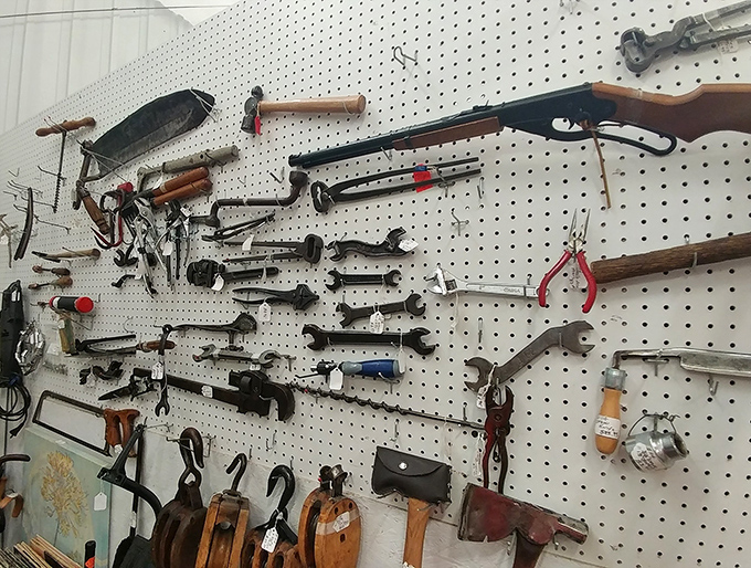 Tools that built America hang in silent testimony to craftsmanship. Your grandfather would nod approvingly at this wall of well-worn wisdom.
