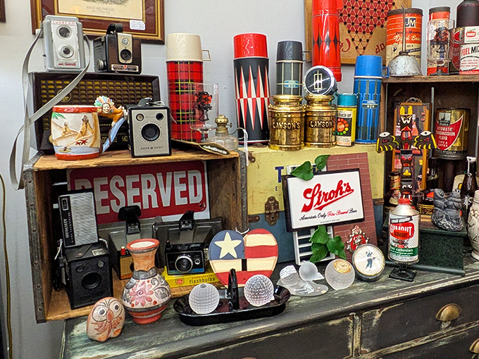 Vintage cameras and collectibles huddle together like old friends sharing decades of captured memories perfectly.
