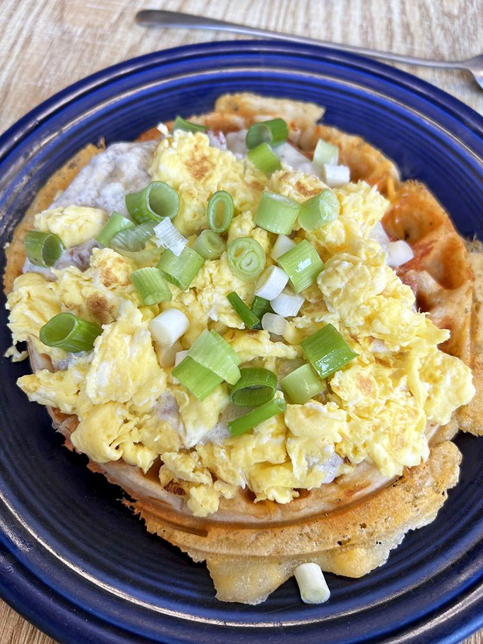 Blue plate special magic! Those fluffy pancakes, scrambled eggs, and sausage links form the holy trinity of breakfast satisfaction.