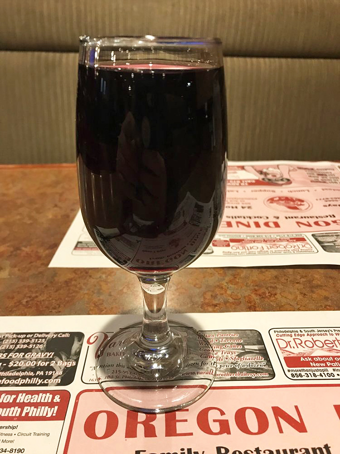 Even the house wine comes with a side of unpretentious charm, served in a glass that says, "We're here for comfort, not wine tasting notes."