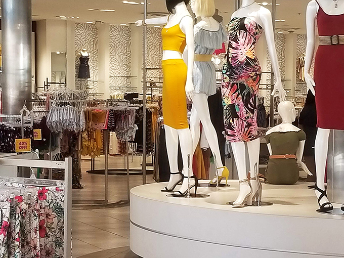 Mannequins sporting summer's hottest looks, silently judging your current wardrobe while tempting you with outfits at prices that won't require a second mortgage.
