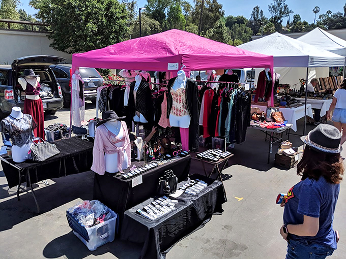 Fashion history hangs in the balance under this pink tent, where vintage clothing awaits its second chance to make a first impression.