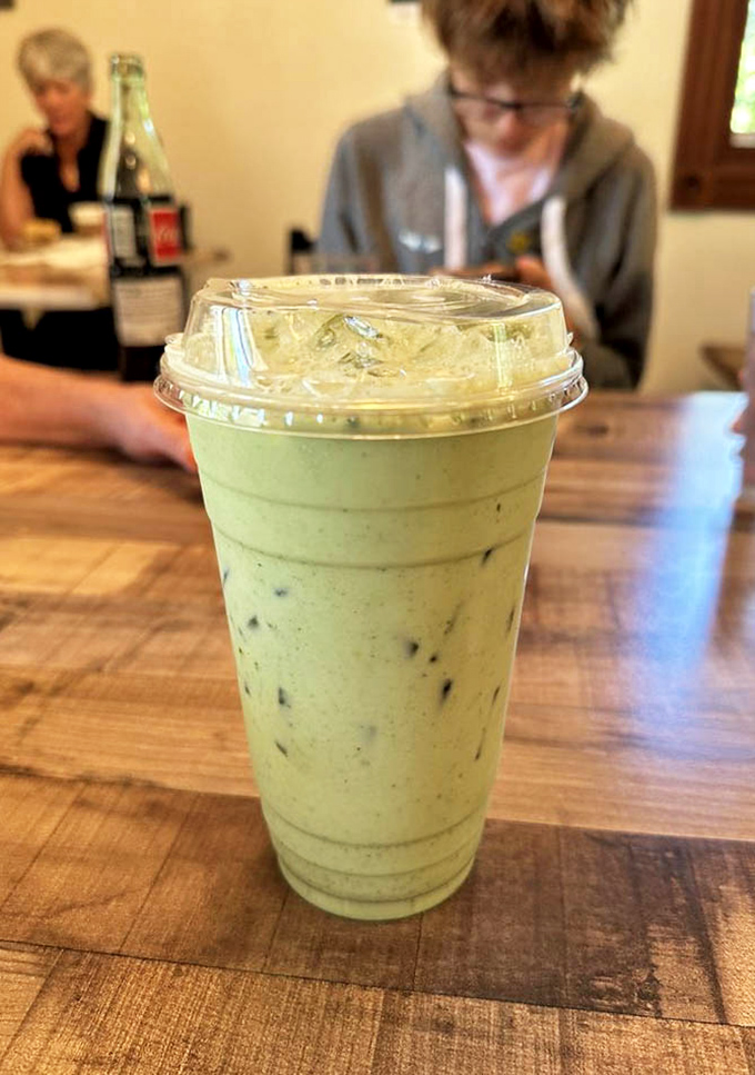 That vibrant matcha latte isn't just a drink&mdash;it's a moment of zen in a cup, the perfect companion to whatever treat you've selected.