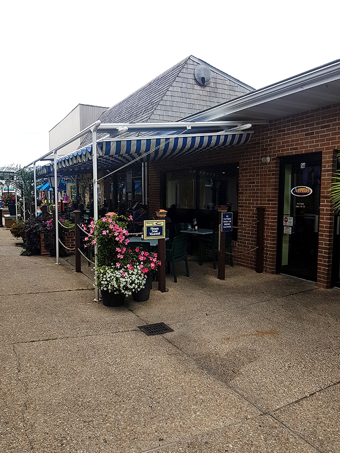 Striped awnings and outdoor seating create the perfect recipe for leisurely beach town dining bliss.