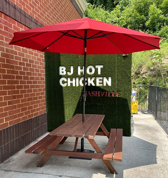 BJ's green grass wall creates an oasis where spicy chicken dreams come true, one crispy bite.