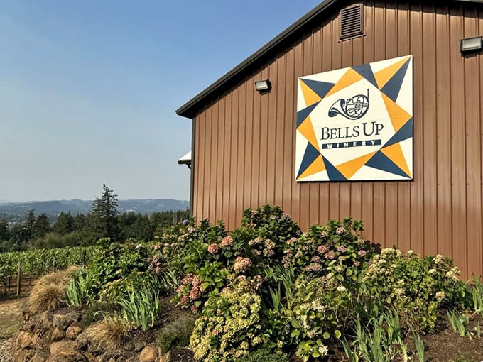 Colorful barn quilt art celebrates rural heritage while modern winemaking happens just steps away.