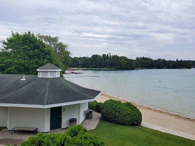 Elkhart Lake's beach pavilion stands ready for summer fun, with crystal-clear waters just steps from the door.