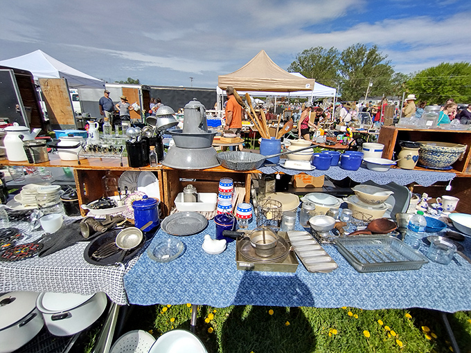 Tables overflow with vintage kitchenware, each piece carrying memories of family meals shared.