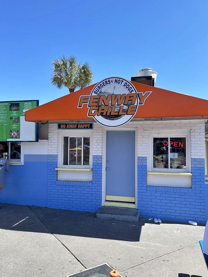 That bright orange roof acts like a beacon, calling all serious hot dog enthusiasts to paradise.