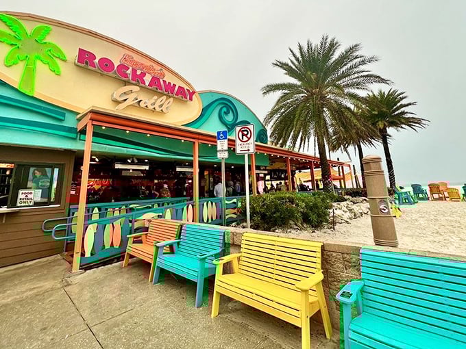 Tropical paradise found! Frenchy's rainbow-colored benches and retro neon sign create a Jimmy Buffett song come to life on Clearwater Beach.