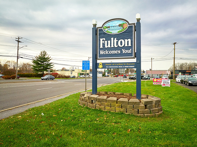 Fulton's welcome sign greets visitors with promises of small-town hospitality. Where your dollar stretches and your smile widens!