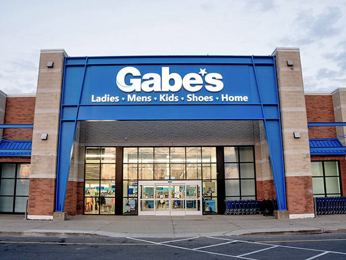 Polished storefront design brings department store elegance to the discount shopping experience beautifully.