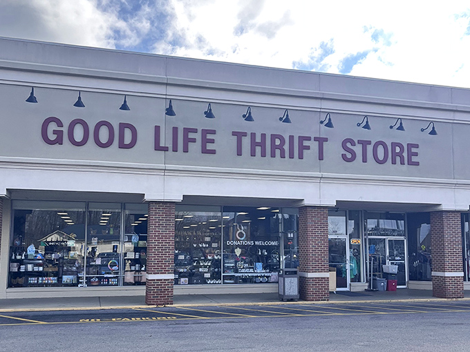 Good Life Thrift Store's charming exterior with blue accent lamps sets the stage for a more refined secondhand shopping experience.