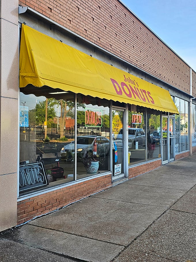 John's yellow awning beckons like a beacon of hope for anyone seeking authentic donut perfection.