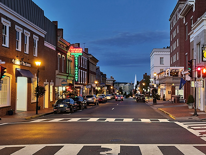 Lexington after dark: where neon signs jazz up brick facades and the crosswalk practically begs you to do your best Abbey Road impression.