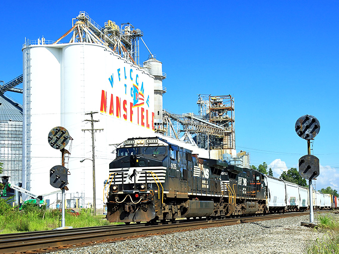 Mansfield's railroad heritage comes alive as freight trains roll past grain elevators, celebrating the city's agricultural roots.