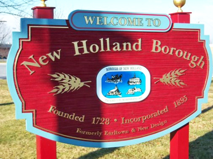 New Holland's welcoming sign proudly displays three centuries of agricultural heritage and small-town American values.