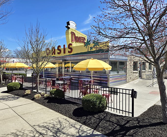 Chrome diner perfection with yellow umbrellas - Oasis Diner serves up 1950s atmosphere with every comfort food order.