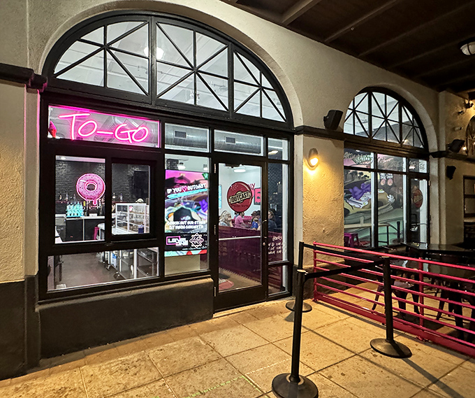 Those elegant arched windows at Outcast Doughnuts frame sweet rebellions against ordinary pastries.