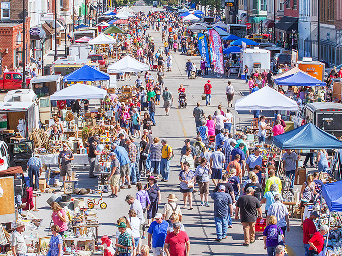 Small-town charm meets big-city treasure hunting as vendors line historic downtown streets perfectly.