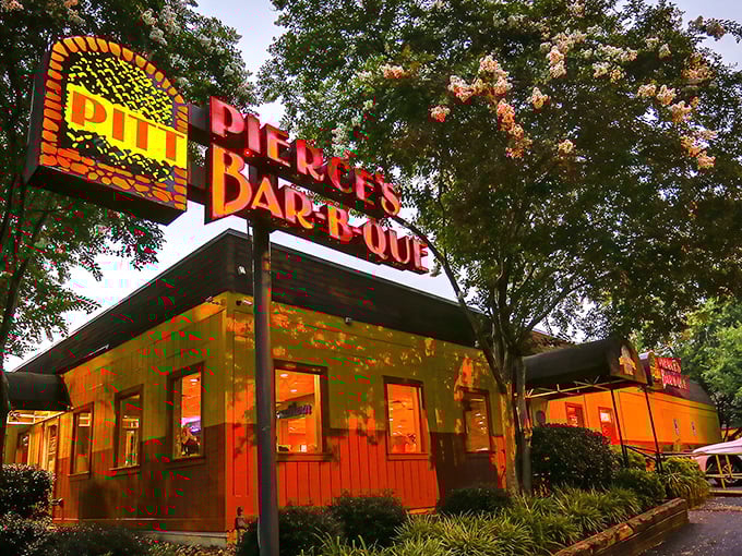 That colorful exterior isn't just eye-catching; it's advertising some seriously delicious barbecue happening inside those walls.