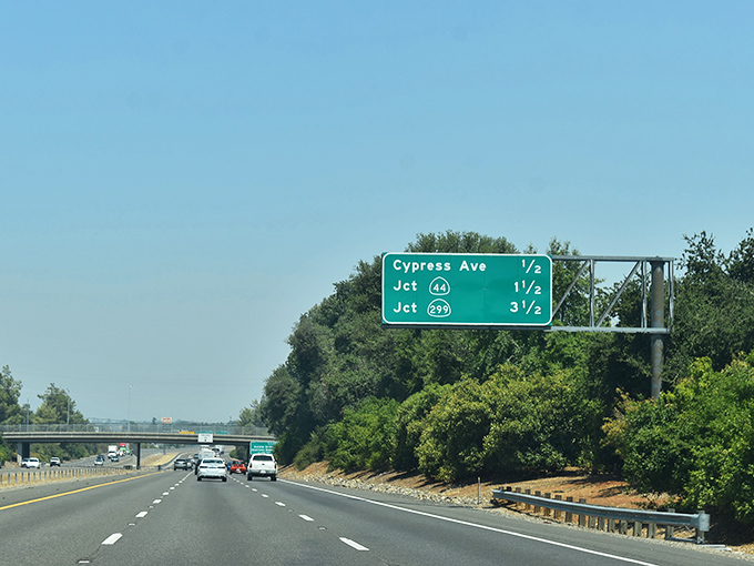 Highway signs point toward new adventures, where retirement dreams meet realistic budgets on California's open roads.