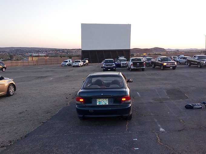 Barstow's cinematic oasis rises from the desert floor, where this sedan waits patiently for darkness to transform the screen from blank canvas to storyteller.