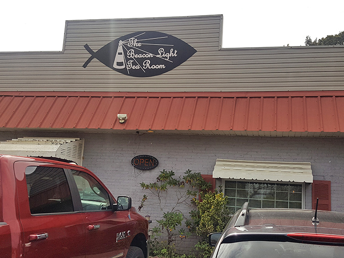 The Beacon Light's charming fish sign hints at its humble beginnings. But locals know the fried chicken is the real star of this show!