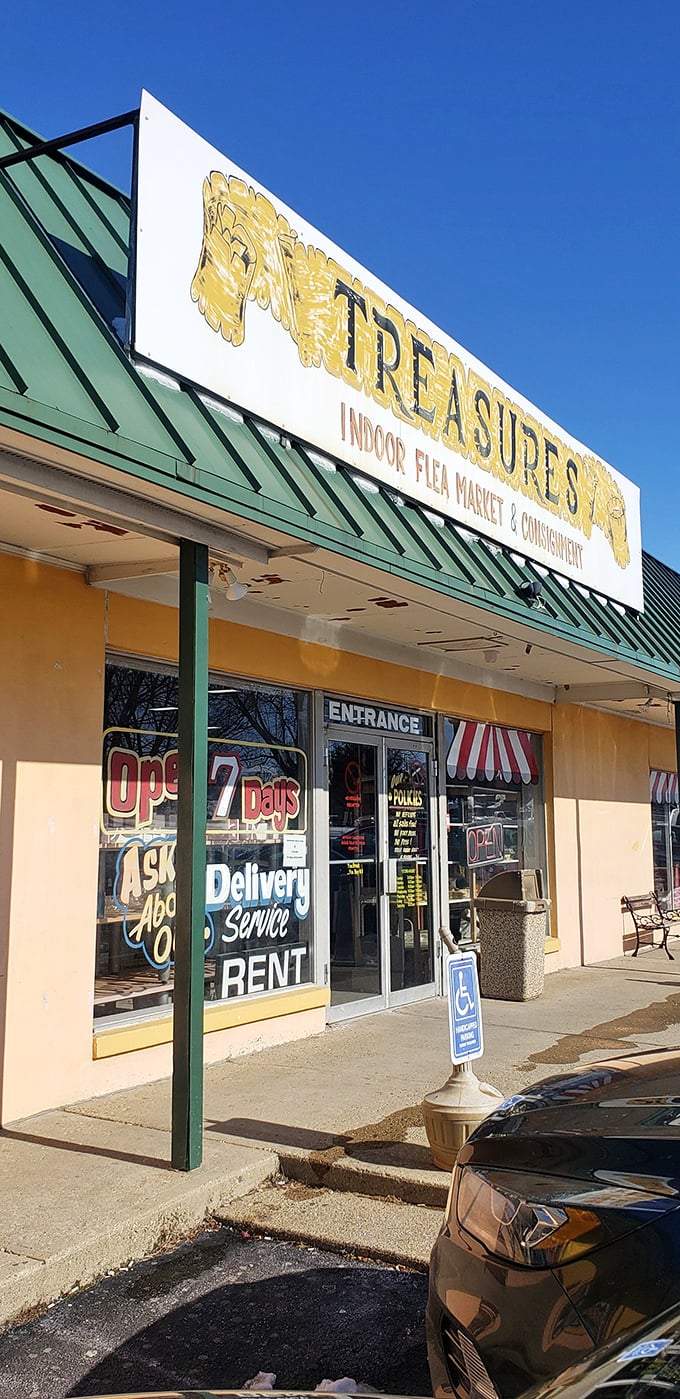 That cheerful yellow storefront with green awnings promises climate-controlled comfort for year-round treasure hunting adventures.