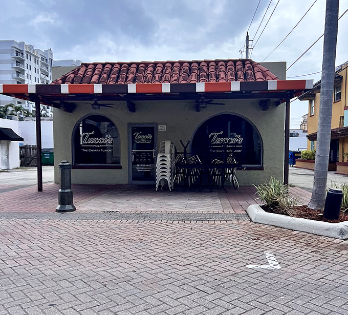 Tucci's Mediterranean-inspired exterior promises coal-fired pizza perfection in the heart of Boca Raton's dining scene.