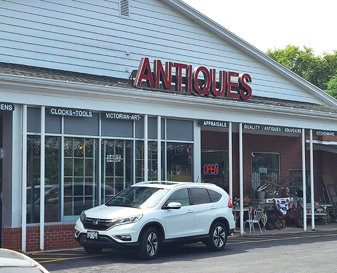 ANTIQUES in red letters - no false advertising here! Just honest-to-goodness treasures waiting to be discovered.